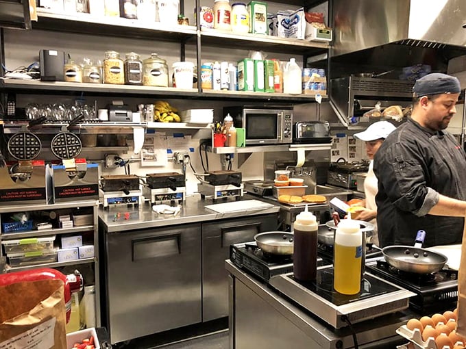 The kitchen &ndash; where ordinary ingredients enter and extraordinary breakfast exits. Those waffle irons are working overtime for your pleasure.