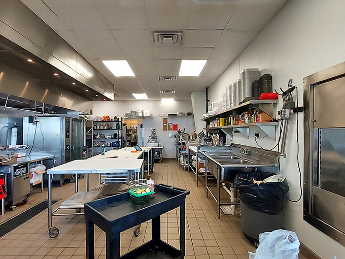 The kitchen where miracles happen daily&mdash;stainless steel and tile setting the stage for culinary alchemy.