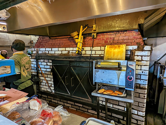 The brick pit where smoke and time work their alchemy. Some kitchens are laboratories; this one's more like a temple.