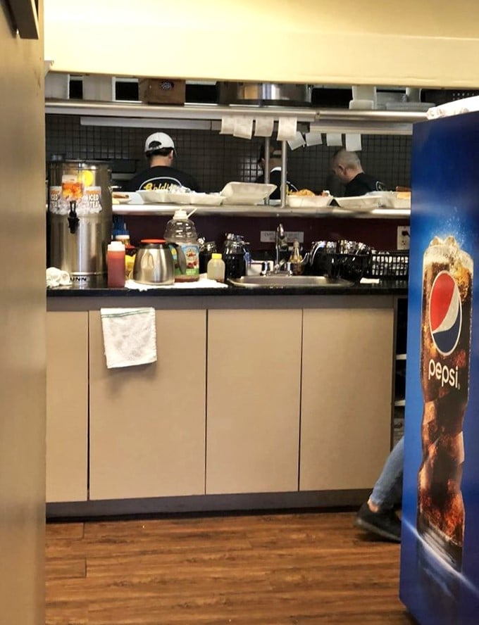 Where the real artistry happens – this open kitchen concept lets you witness breakfast perfection in action.