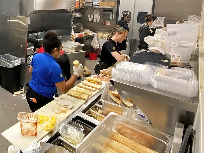 The kitchen ballet—where skilled hands transform simple ingredients into edible memories. This behind-the-scenes glimpse reveals the organized chaos of deliciousness.