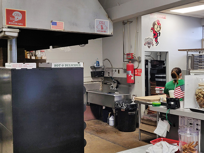 No fancy kitchen stadium here&mdash;just the honest workspace where Italian-American magic happens. Those OSU decorations remind you exactly where you are.