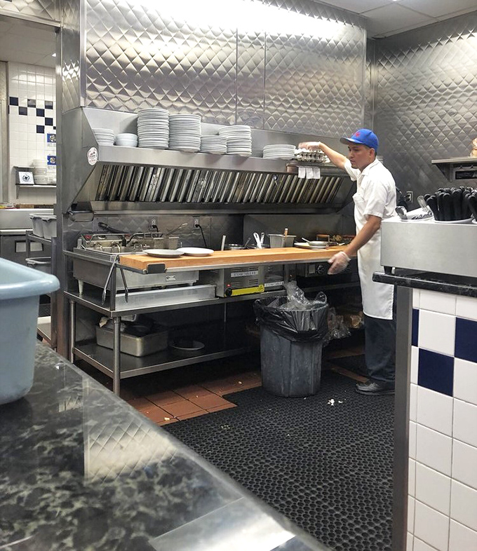 Behind the scenes where the magic happens. Like watching an orchestra conductor, every movement purposeful, every dish a performance.