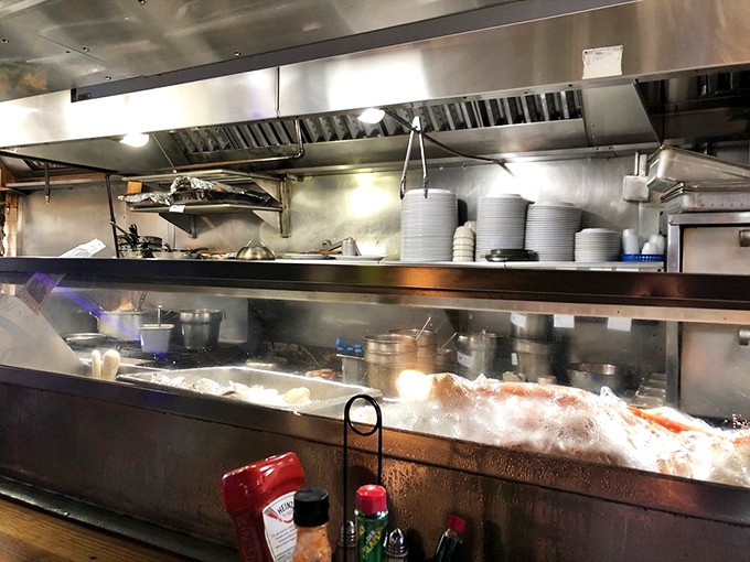 Where the magic happens – this kitchen churns out seafood treasures with the precision of a well-oiled maritime operation.