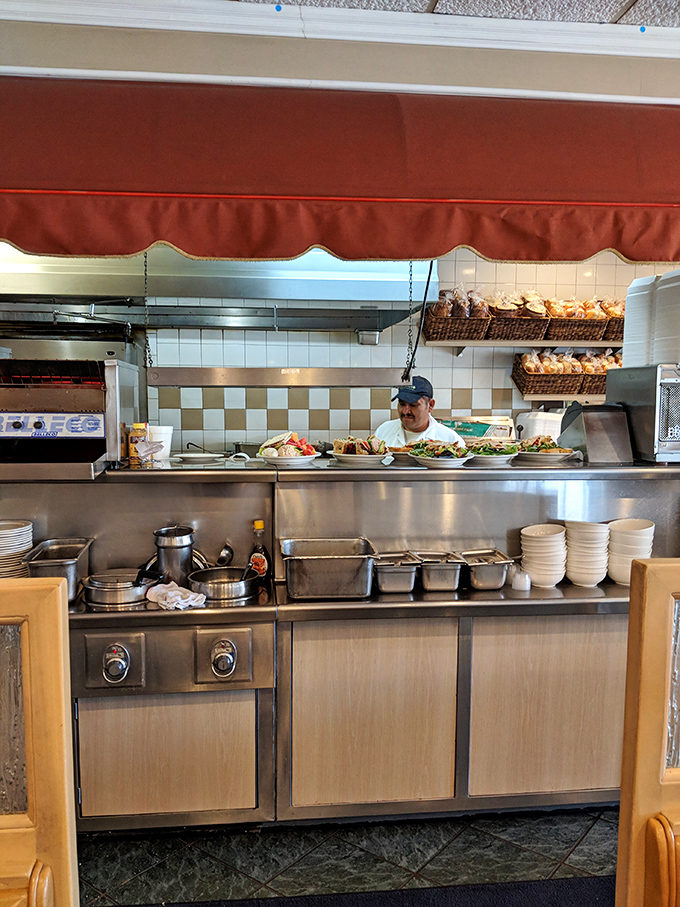 Behind the scenes, culinary magic happens under the watchful eye of a chef who knows his knishes from his kugel.