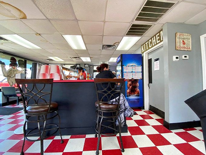 That "Kitchen" sign might as well read "Magic Happens Here." The simple entrance to where ordinary ingredients become extraordinary meals.