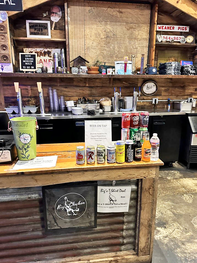 A bar setup that understands priorities: good drinks to wash down great chicken. Those vintage signs and knickknacks tell stories between bites.