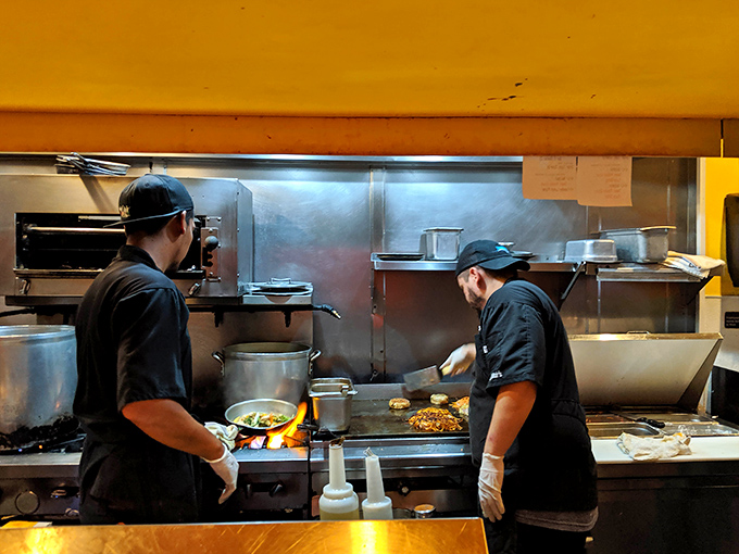 Watching these chefs work is like seeing a silent symphony where the music comes in the form of sizzles, aromas, and perfectly timed flips.
