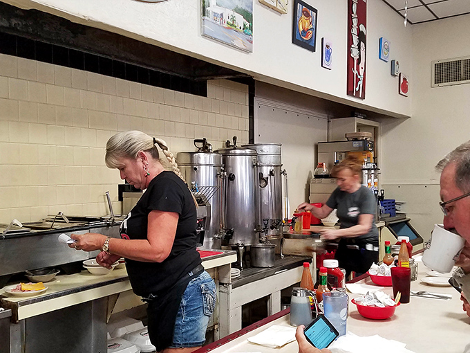 Another angle revealing the organized chaos that produces consistently exceptional breakfast experiences daily.