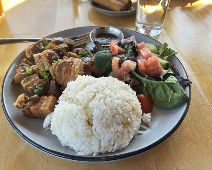 Lechon that's traveled all the way from Manila to Ohio to make your taste buds do a happy dance. Rice never had a better companion.