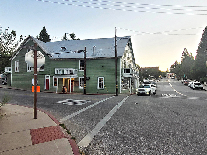 This mint-green historic building catches the golden hour light perfectly. Nevada City transitions from day to evening with cinematic grace.