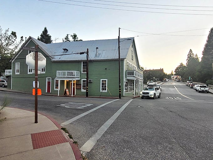 This mint-green historic building catches the golden hour light perfectly. Nevada City transitions from day to evening with cinematic grace.