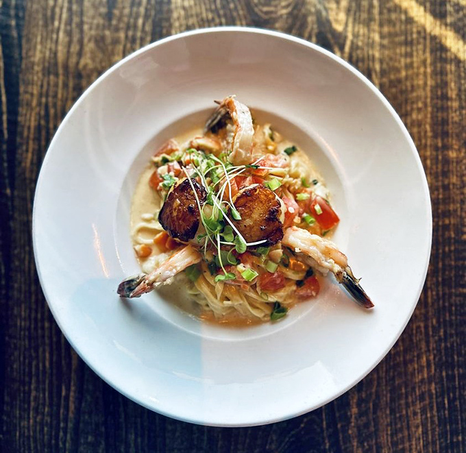 This isn't just pasta&mdash;it's a seafood symphony where plump shrimp and scallops take center stage atop a bed of perfectly cooked linguine in a sauce worth sopping up.