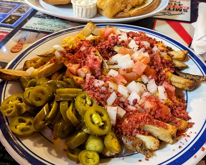 Loaded River Fries: where jalapeños, cheese, tomatoes, and bacon throw the kind of party your taste buds talk about for weeks.