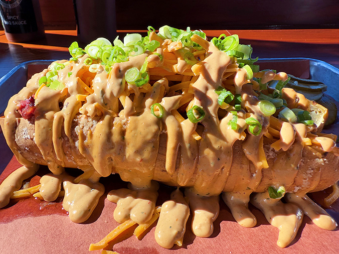 Not just a potato&mdash;it's a canvas for culinary creativity. Loaded with sauce, green onions, and enough cheese to make Wisconsin proud. 