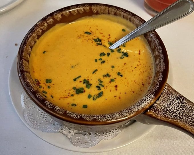 Lobster bisque so velvety smooth it could teach silk lessons. That rich orange color isn't just for show&mdash;it's a promise of flavor.