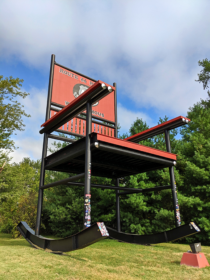 Looking up at the Red Rocker reveals the stickers and signatures of countless visitors, each leaving their mark on this beloved Route 66 icon.