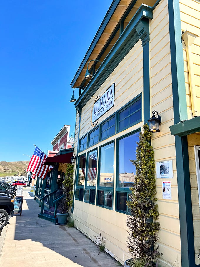 Lunada Garden Bistro's crisp white exterior and American flag offer a picture-perfect slice of coastal dining, where patriotism meets Pacific views.