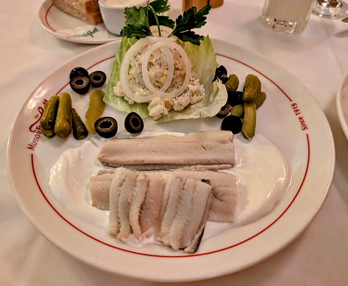 The seafood platter arrives like a supporting actor who steals the scene &ndash; pickled herring, potato salad, and garnishes arranged with old-school elegance.