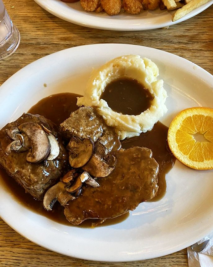 Meatloaf and mashed potatoes that would make your grandmother simultaneously proud and jealous, served with gravy that deserves its own fan club.