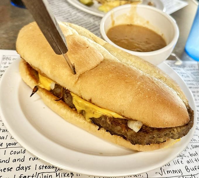 This isn't just a sandwich &ndash; it's a meat lover's dream on bread. Melted cheese cascades over the edges like a delicious waterfall.