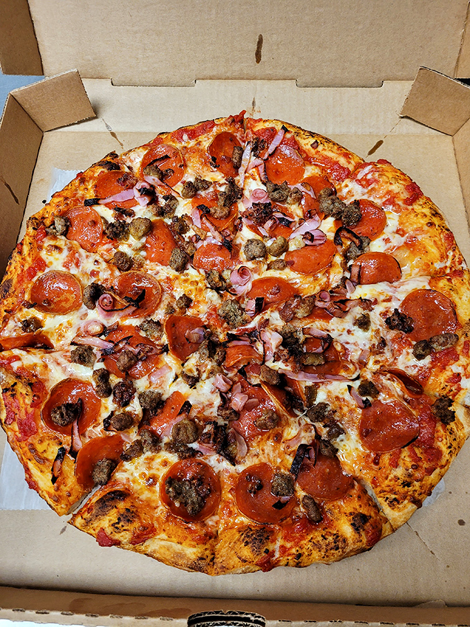 The meat lover's pizza doesn't just have toppings&mdash;it has population density. Each bite is a neighborhood of flavors getting along beautifully.