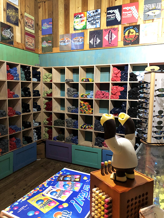 The merch corner proves people will buy anything to remember great food, with t-shirts that say "I came for the views but stayed for the coconut shrimp."