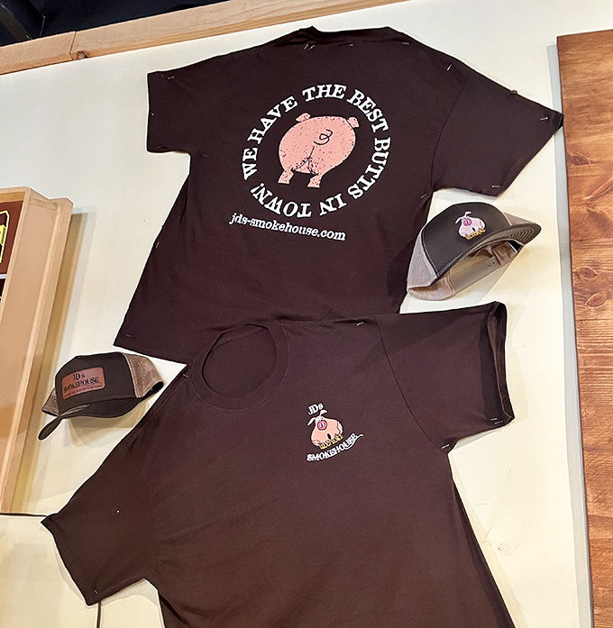 The unofficial uniform of barbecue devotees: a t-shirt proudly declaring allegiance to pork, paired with a hat to hide sauce-splattered hair.