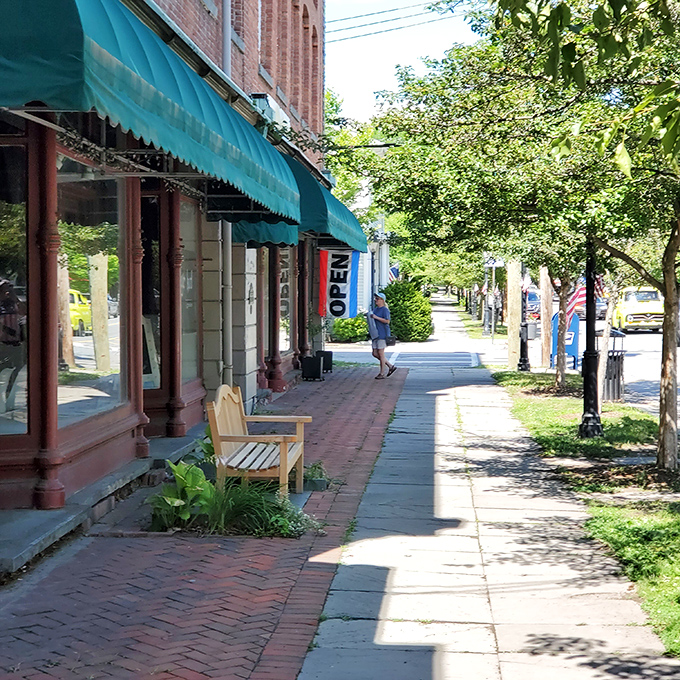 Milford's sidewalks practically narrate their own walking tour. That bench isn't just sitting there &ndash; it's waiting to offer you the best people-watching seat in town.