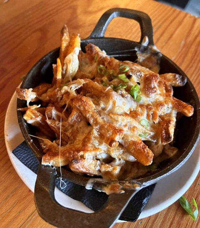 These aren't your average fries&mdash;they're a cheese-covered revelation that makes sharing nearly impossible, despite your best intentions.