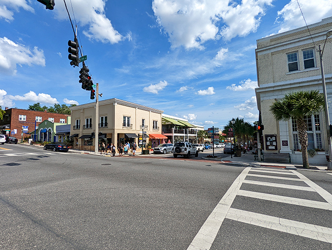 The historic district's pristine storefronts and wide sidewalks invite leisurely exploration—window shopping elevated to an art form under Florida's blue skies.