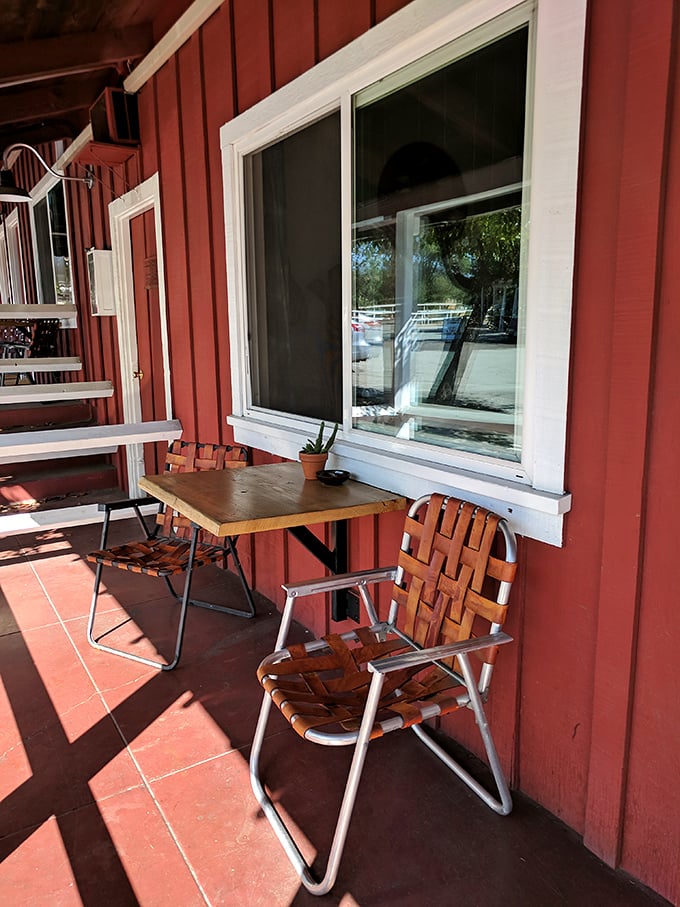 Simple pleasures await at the Ojai Rancho Inn, where a wooden chair in dappled sunlight becomes the perfect spot for morning coffee.