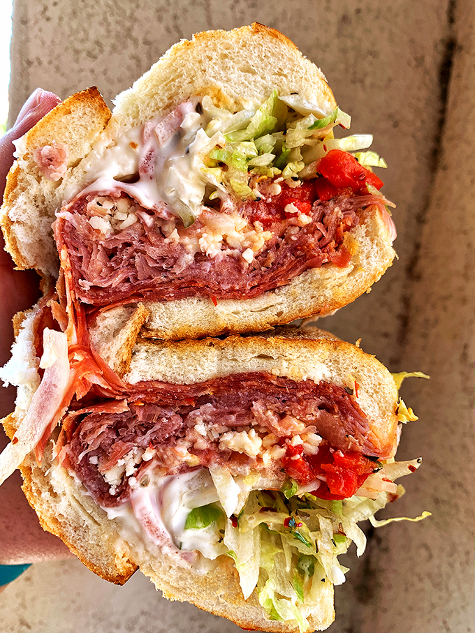 The Old Fashioned Italian hoagie cross-section reveals the geological layers of deliciousness that make this a carnivore's dream.