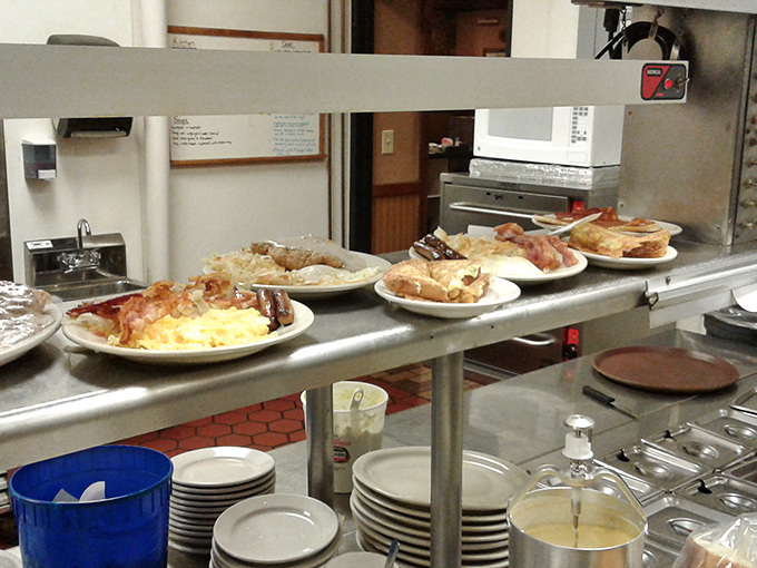 The open kitchen pass&mdash;where plates wait their turn to make someone's day better, one comfort food classic at a time.