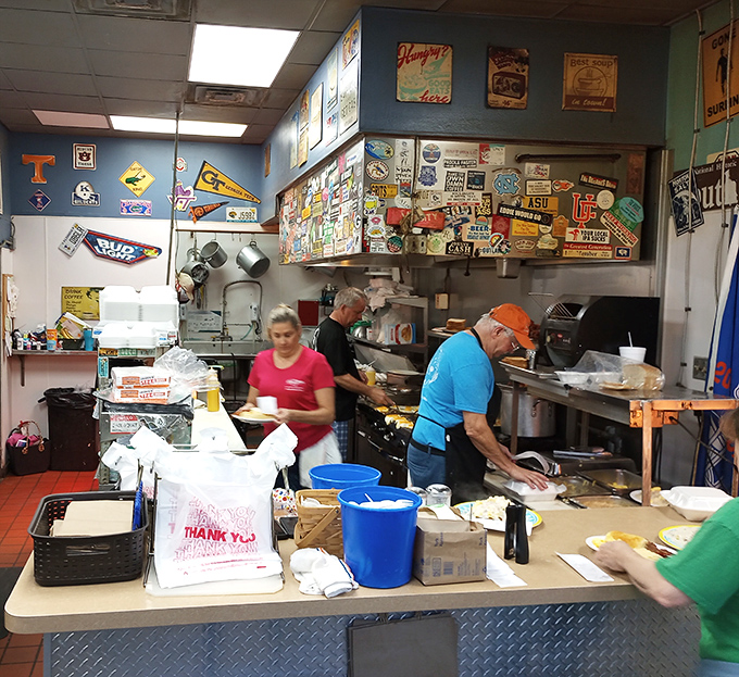 The open kitchen&mdash;where magic happens without smoke and mirrors, just skilled hands and decades of know-how. Culinary theater at its finest.