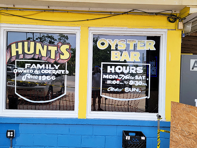 The operating hours posted on Hunt's sunny yellow facade are basically your weekly schedule for seafood happiness. Plan accordingly.