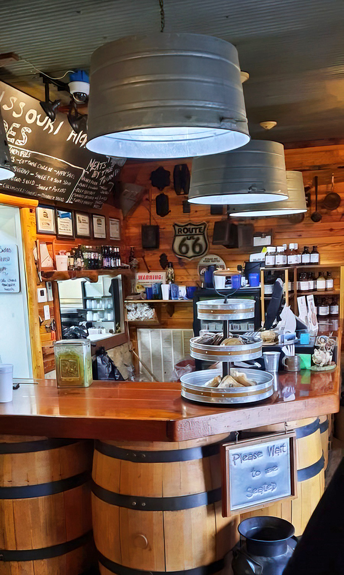 The barrel-based counter and metal bucket lights prove that in the right hands, farm equipment makes for perfect restaurant decor.