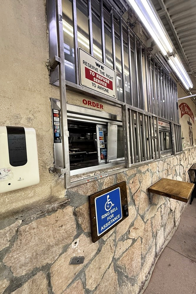 "We reserve the right to refuse service to anyone"&mdash;a sign that's been there so long it's practically part of the decor, like the stone walls themselves.