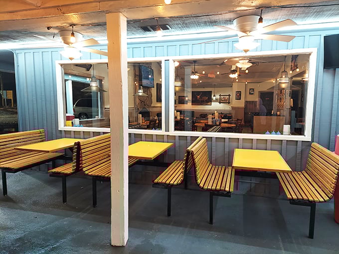 These outdoor booths with their wooden benches offer a front-row seat to the comings and goings of Sweetwater's barbecue pilgrims.