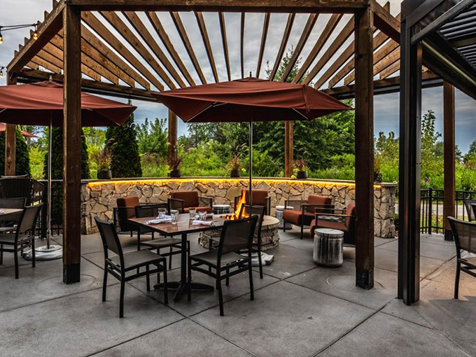 Outdoor seating that makes Indiana summers bearable—even enjoyable. That fire feature isn't just for warmth—it's for making s'mores memories with your dinner companions.