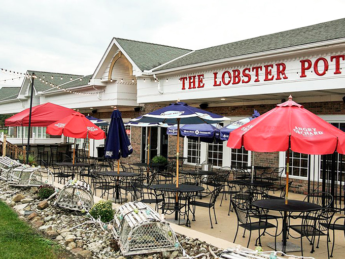 The patio invites you to dine al fresco under colorful umbrellas, proving lobster tastes even better with a side of sunshine.