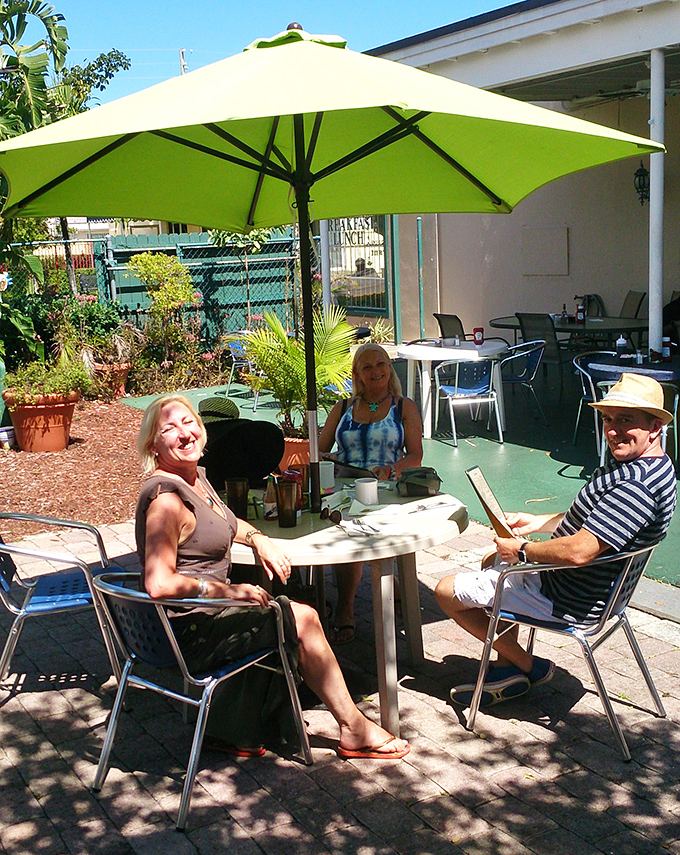 Florida's perfect weather deserves outdoor seating like this - shaded tables where breakfast stretches lazily into lunch.