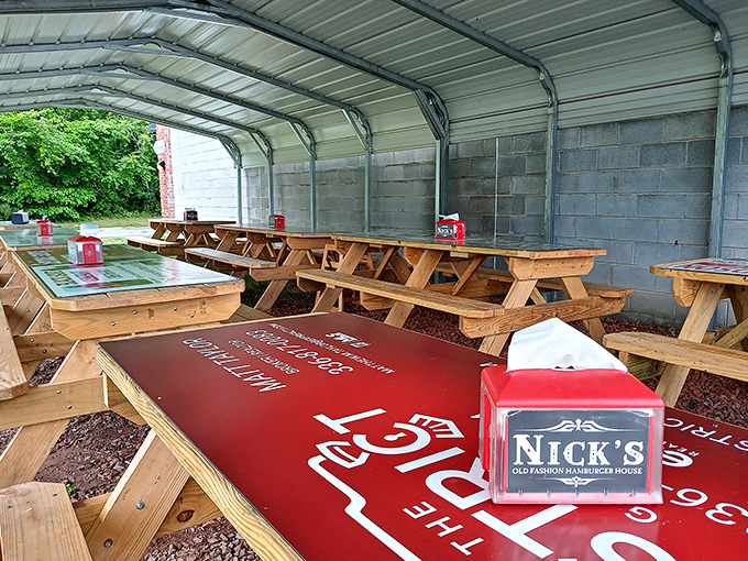 Outdoor picnic tables under cover &ndash; because sometimes a burger tastes even better with a side of fresh air.