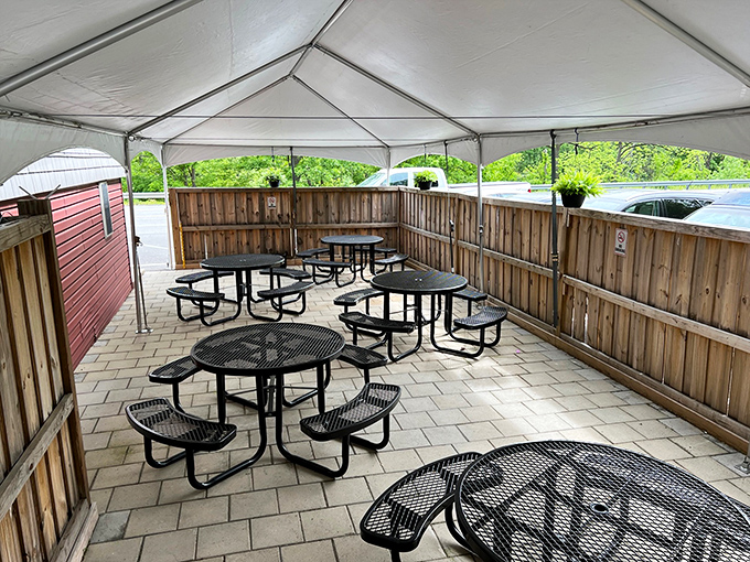 Fair weather dining with a side of fresh air. This covered outdoor seating area offers a perfect perch for people-watching between bites.