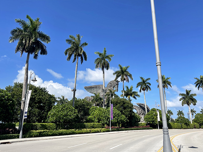 Pegasus peeking through the palms. Florida's landscape frames this massive sculpture in quintessential tropical style.