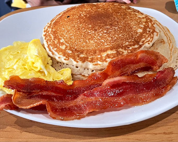 Golden pancakes with perfectly crisped bacon&mdash;the breakfast equivalent of a warm hug from your favorite aunt who really knows how to cook.