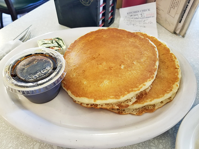 Pancakes golden as Florida sunshine, large enough to use as frisbees but too delicious to waste on such frivolity. 