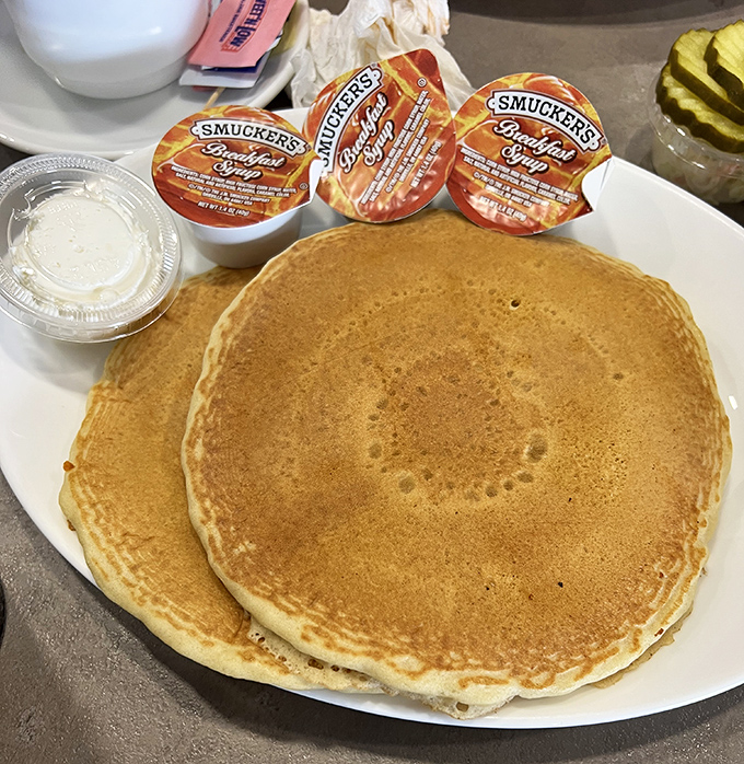 Pancakes so perfectly golden they deserve their own sunrise soundtrack, with Smucker's syrup standing by for the grand finale.