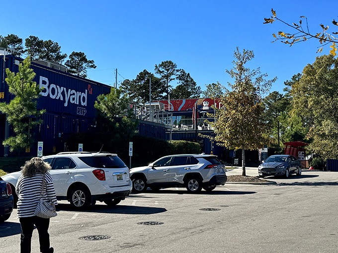 The Boxyard RTP complex stands like a modern food fortress. These shipping containers hold treasures more valuable than gold: perfect BBQ. 