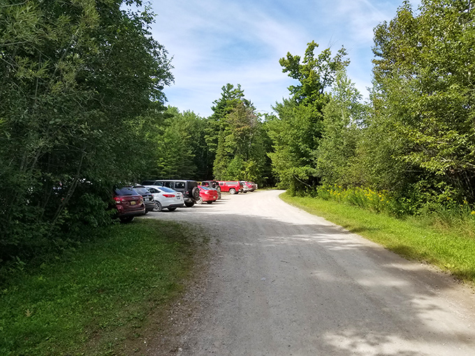 The unassuming parking area serves as the gateway between ordinary life and extraordinary wilderness. Your adventure begins where the pavement ends.